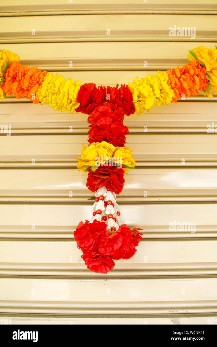 Multi colored flower garland hi-res stock photography and images - Alamy