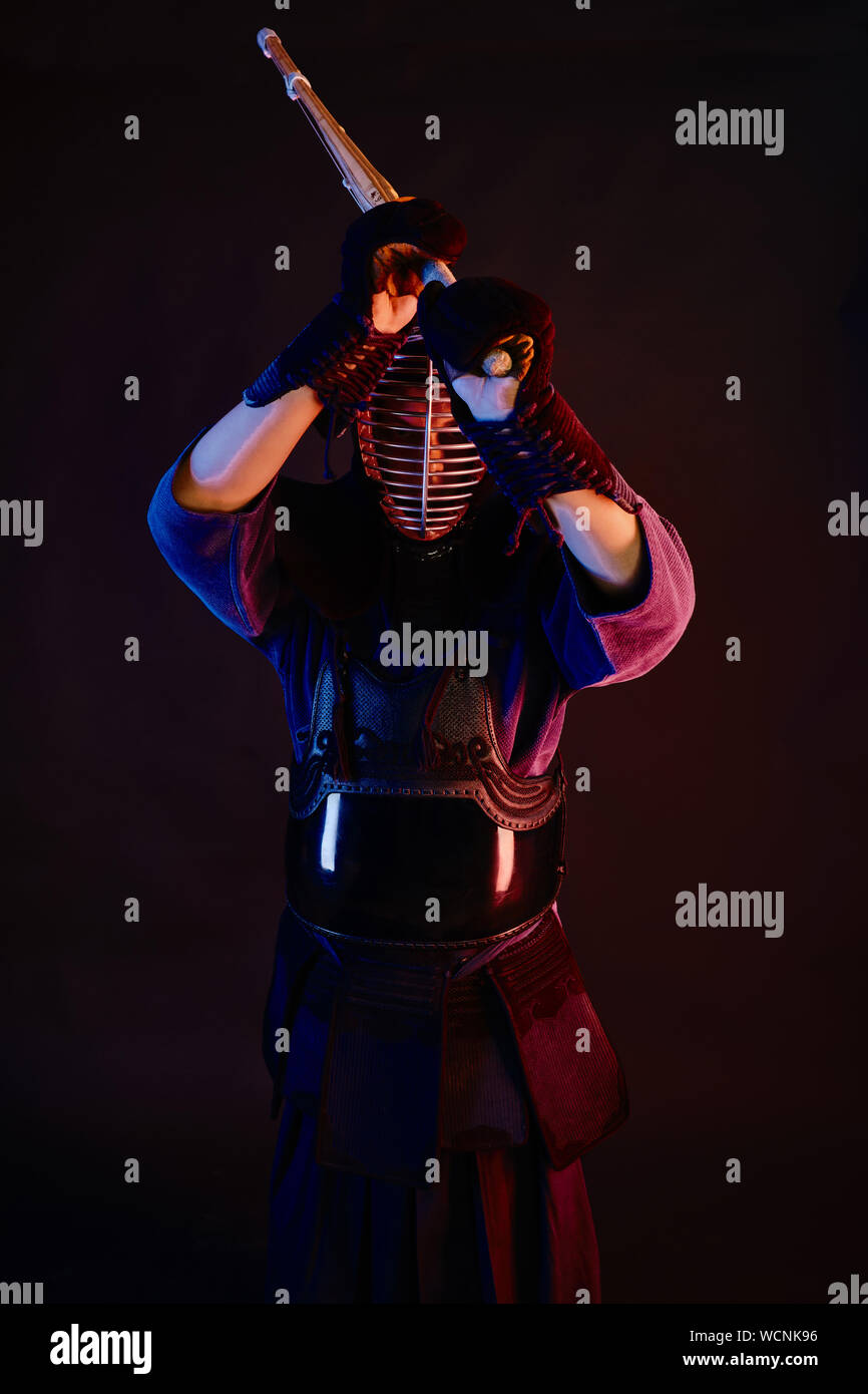 Athletic Kendo master wearing in an armor, traditional kimono and ...