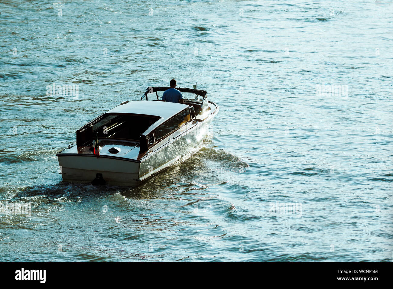 Man riding boat hi-res stock photography and images - Alamy