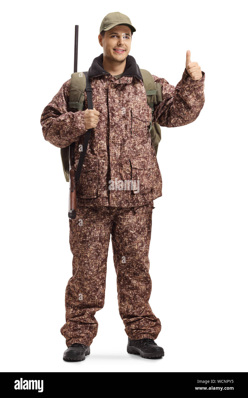 Full length portrait of a hunter in a uniform showing thumbs up ...