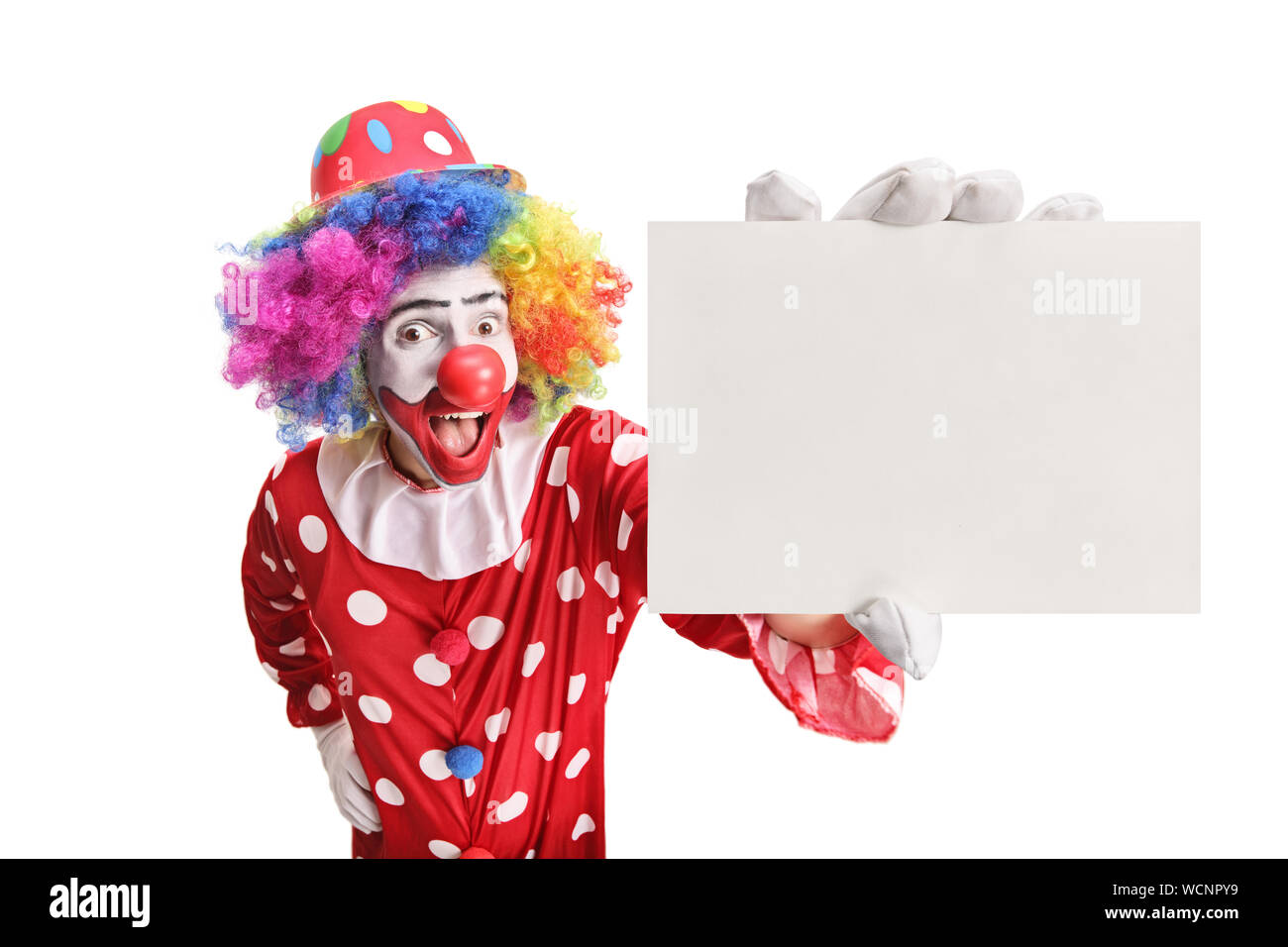 Smiling clown showing a blank card isolated on white background Stock ...