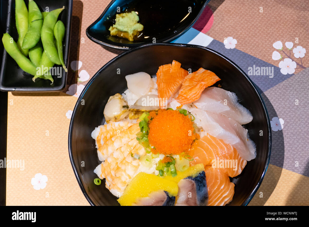 Sashimi in bowl with fish eggs and rice Stock Photo - Alamy