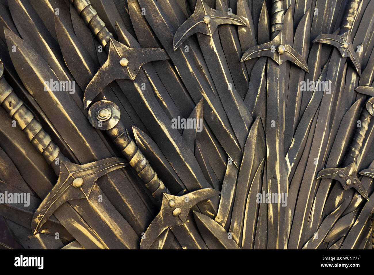 Swords background. Piles of ancient bronze cold weapon close up view ...