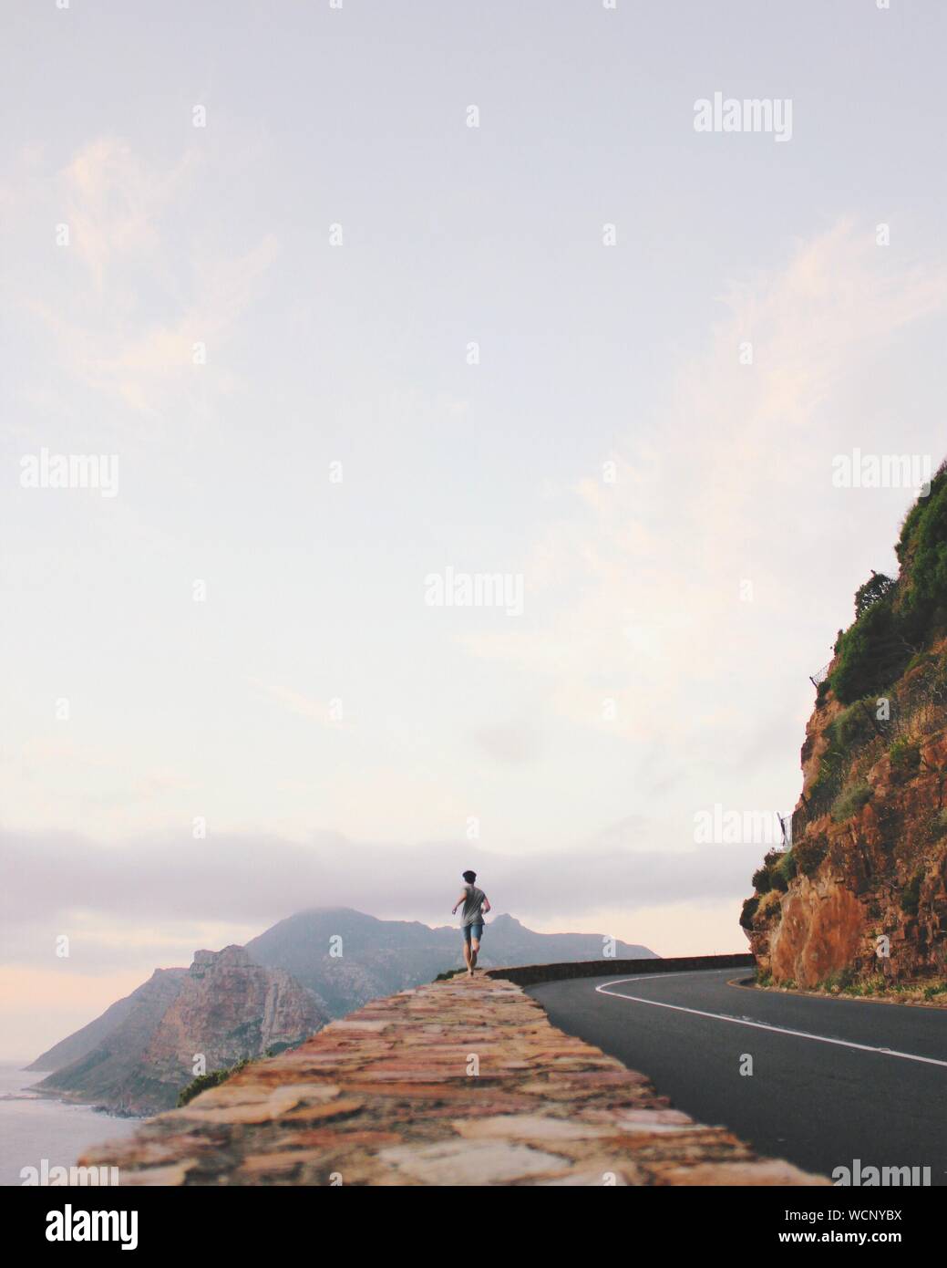 Person running road mountain hi-res stock photography and images - Alamy