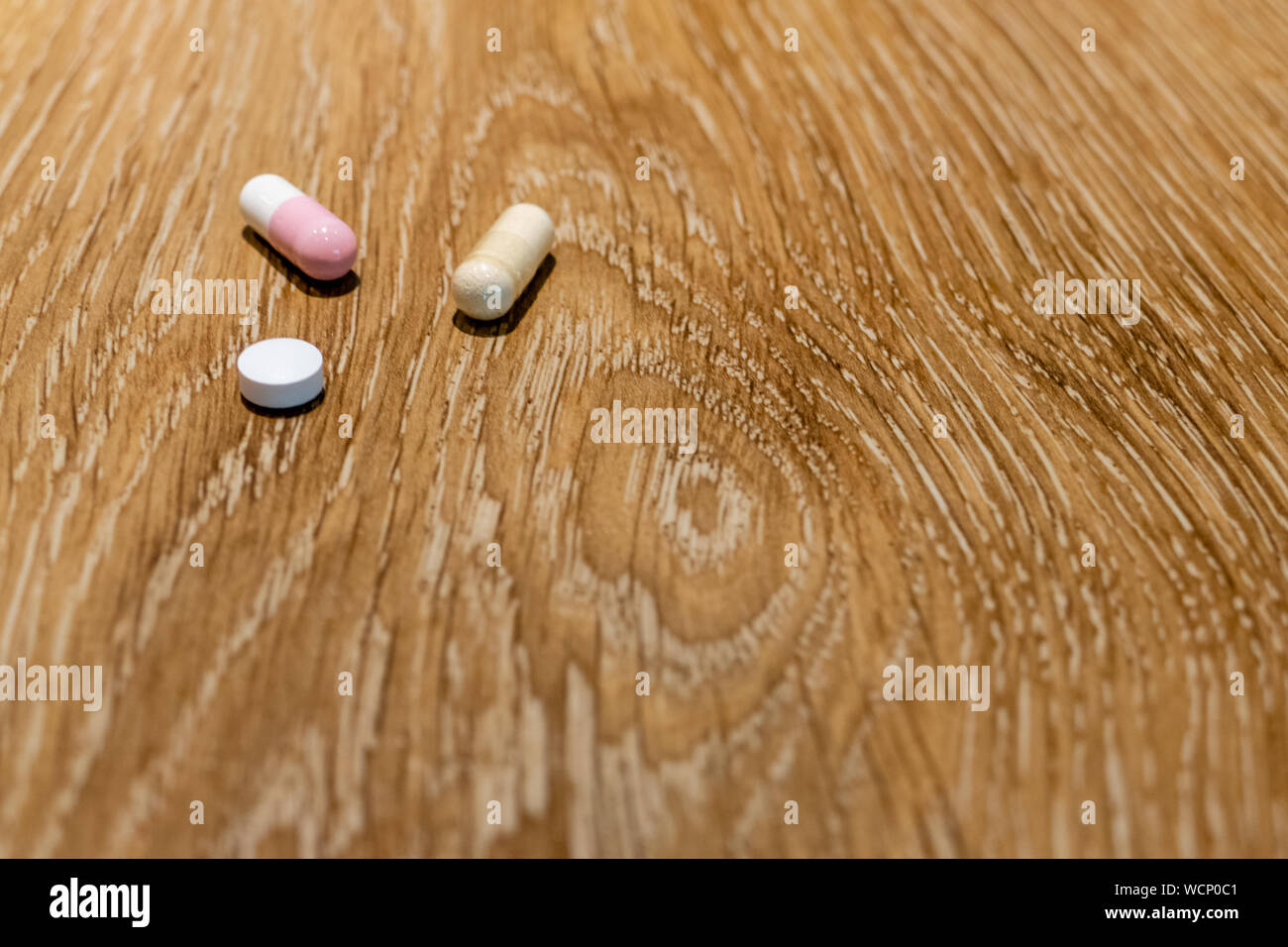 Capsules and pill on table, medical concept Stock Photo - Alamy