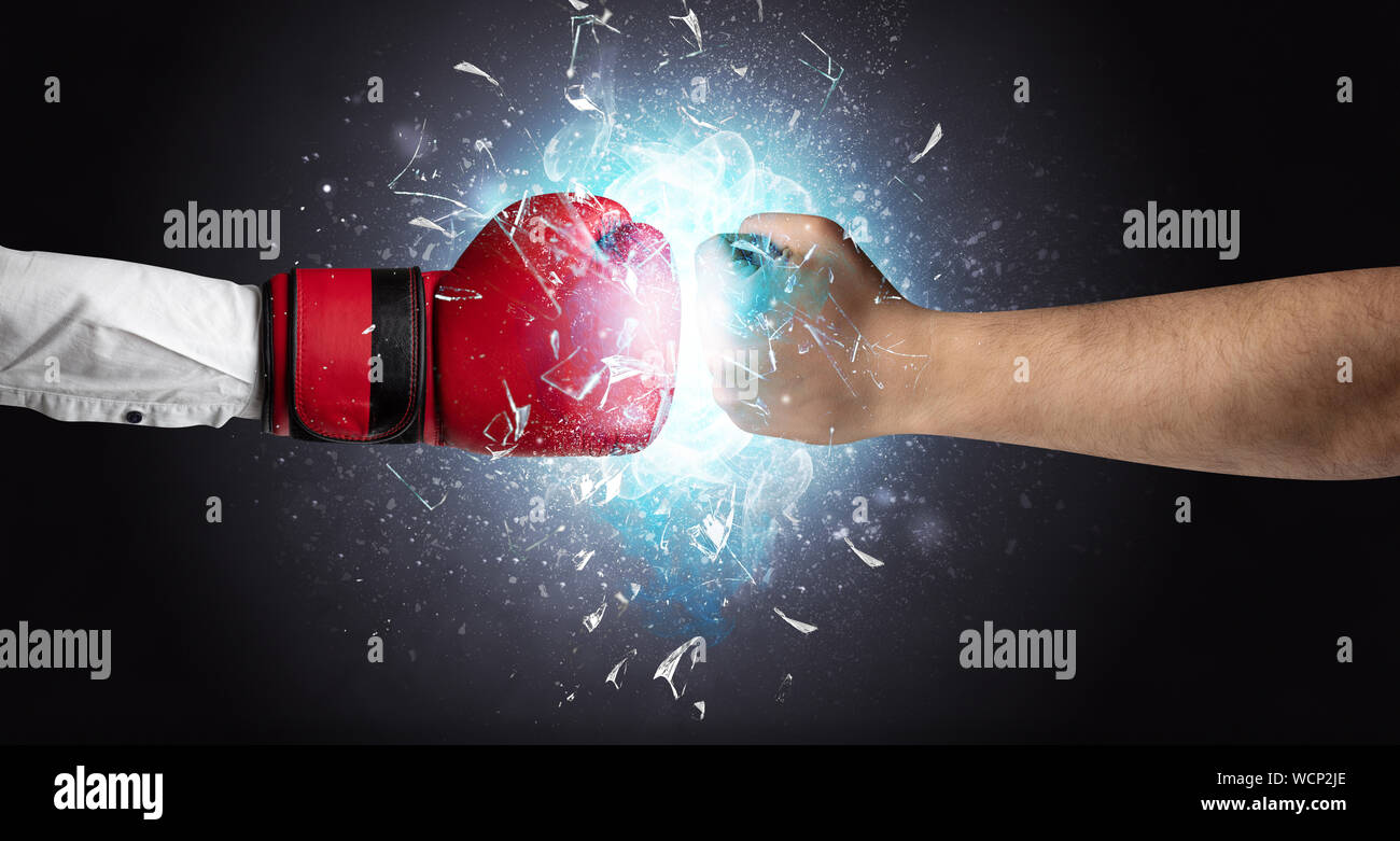 Two hands fighting and breaking glass into small pieces with blue light ...