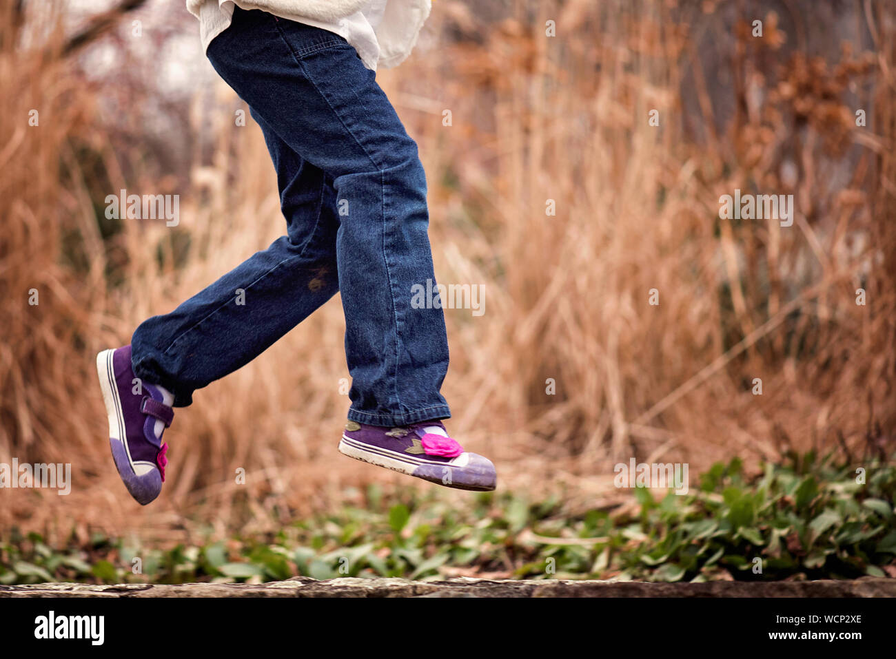 Girl one leg jumping hi-res stock photography and images - Alamy