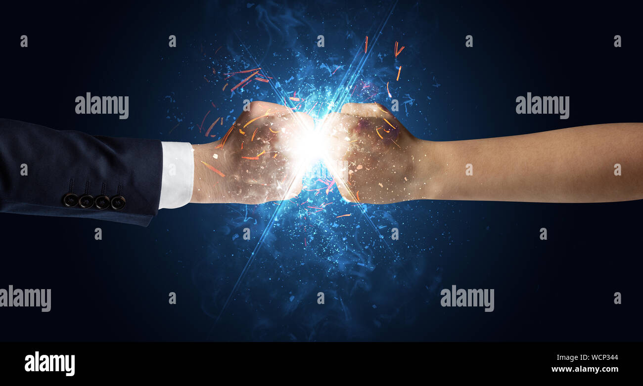 Two hands fighting with light, glow, spark and smoke concept Stock ...