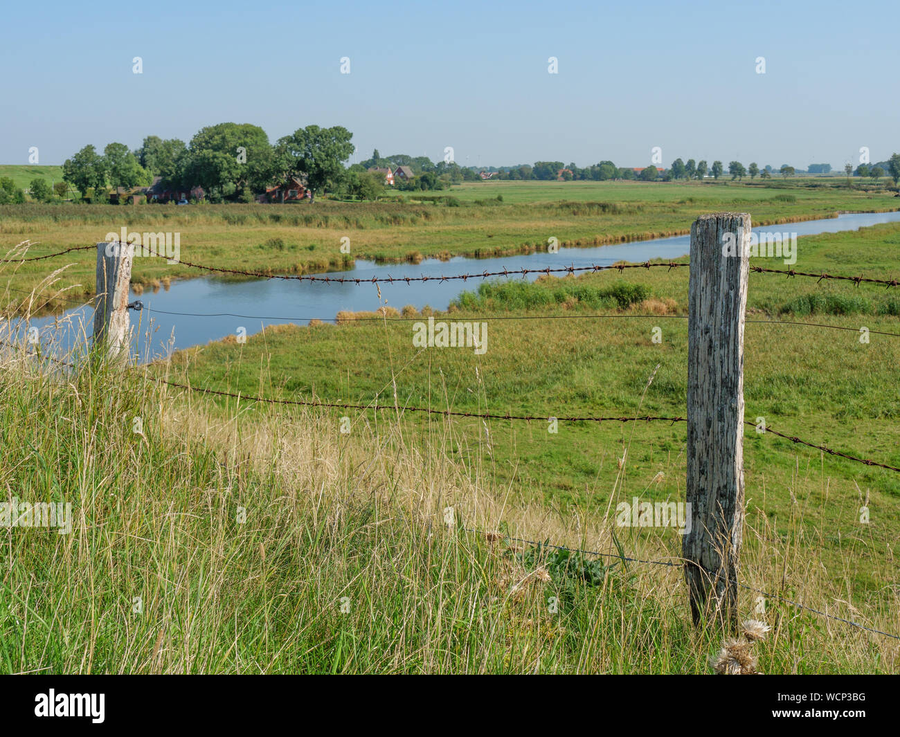 The village of ditzum at the river ems in germany Stock Photo - Alamy