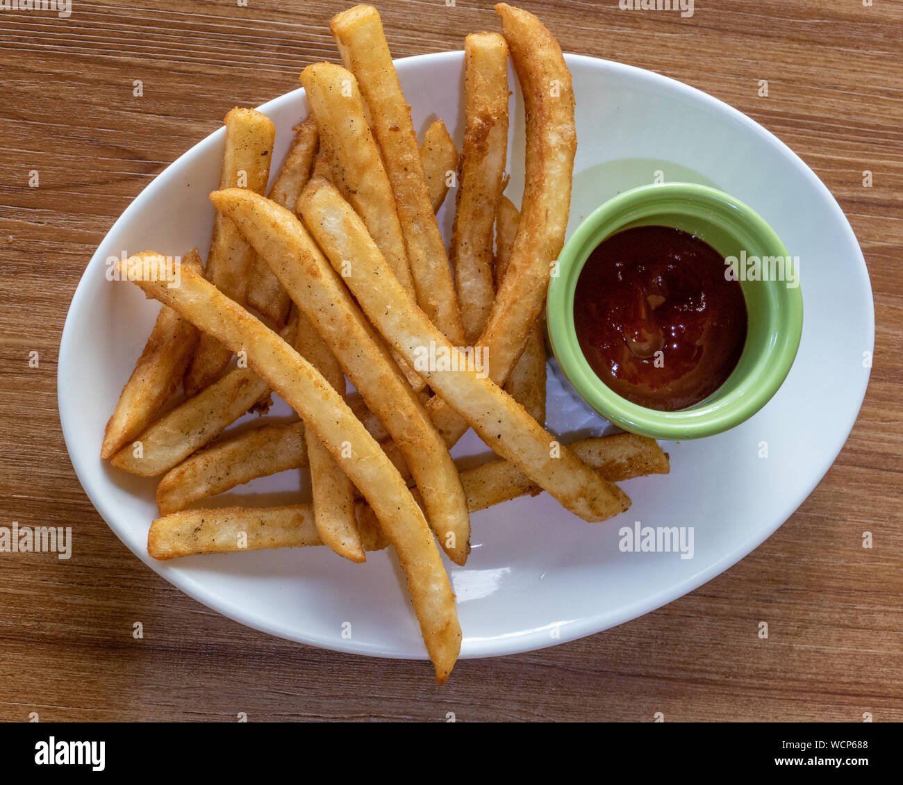 French fries and ketchup on plate, shot from above Stock Photo - Alamy