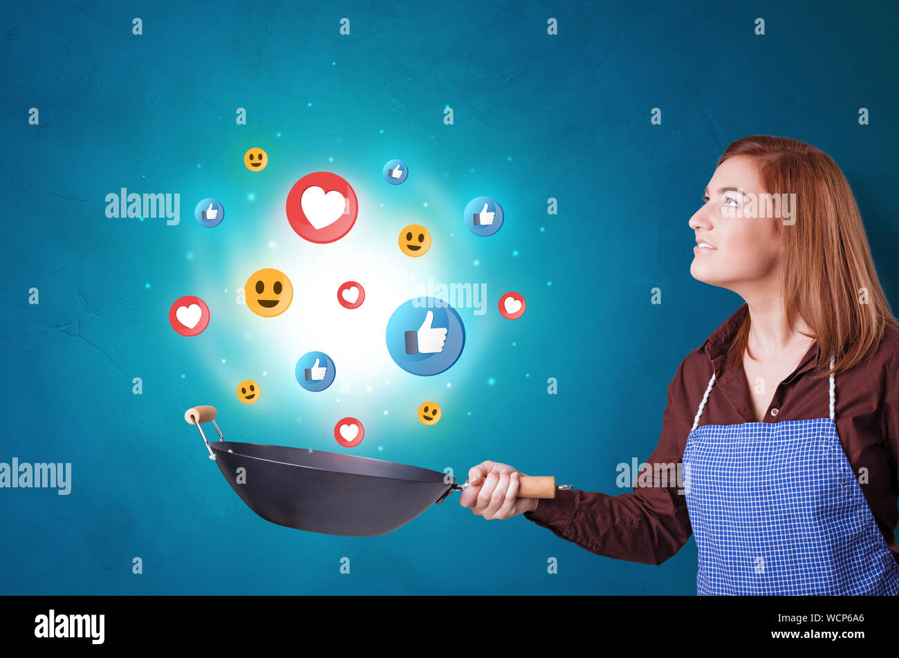 Young happy person cooking social media concept in wok Stock Photo - Alamy