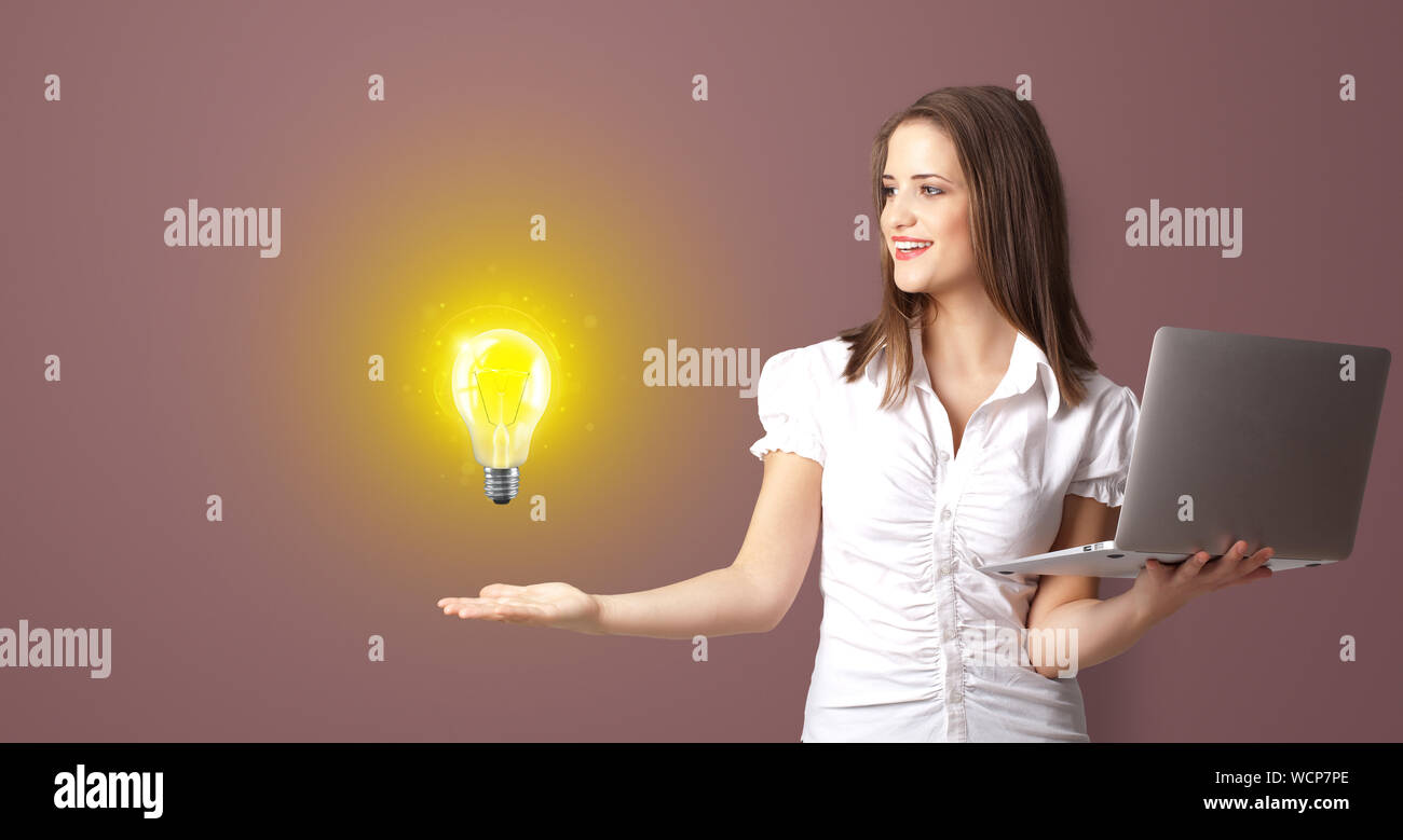 Young smiling person presenting new idea concept Stock Photo - Alamy