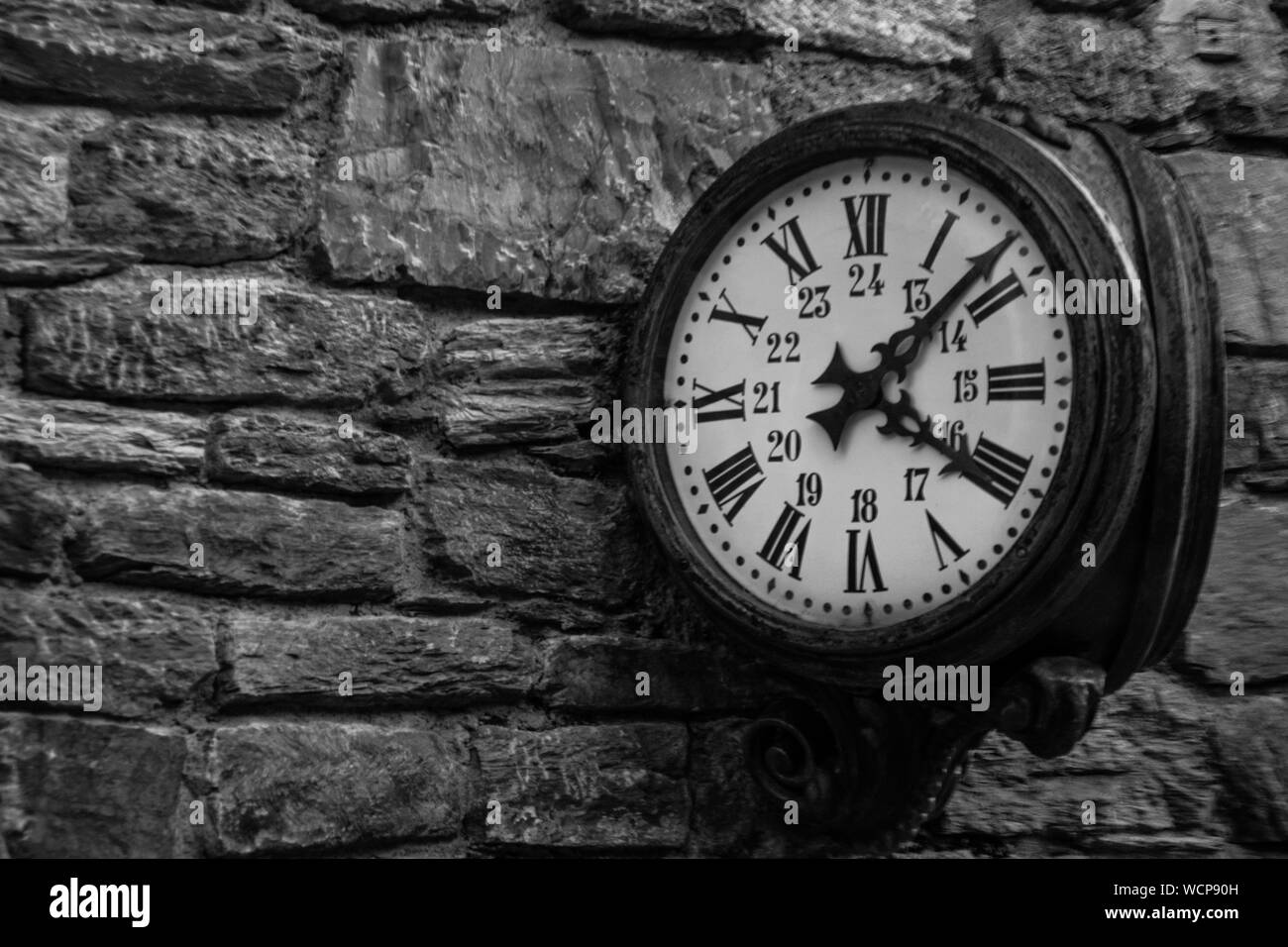The clock hanging on the wall hi-res stock photography and images - Alamy
