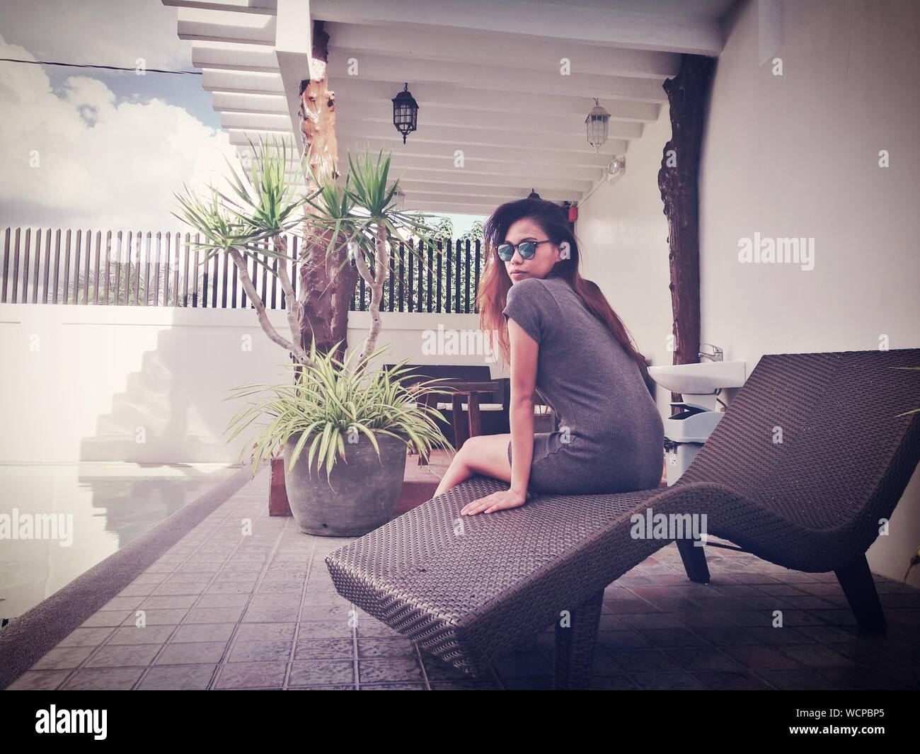 Woman Sitting Lounge Chair High Resolution Stock Photography and Images ...