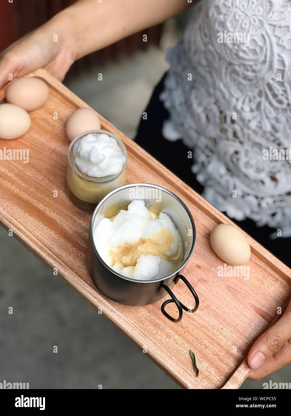 Woman tray in hand hi-res stock photography and images - Alamy