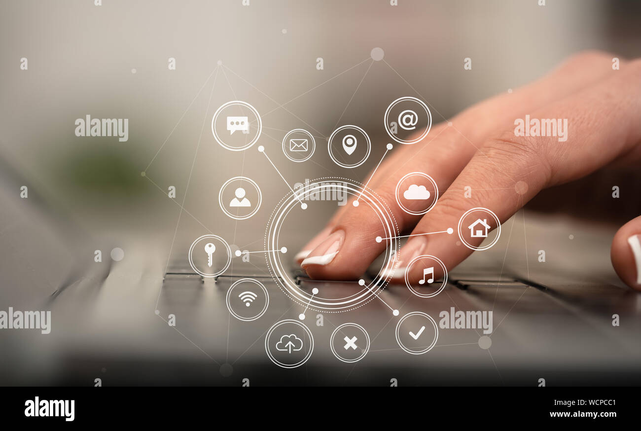 Business woman hand typing on keyboard with application icons around ...