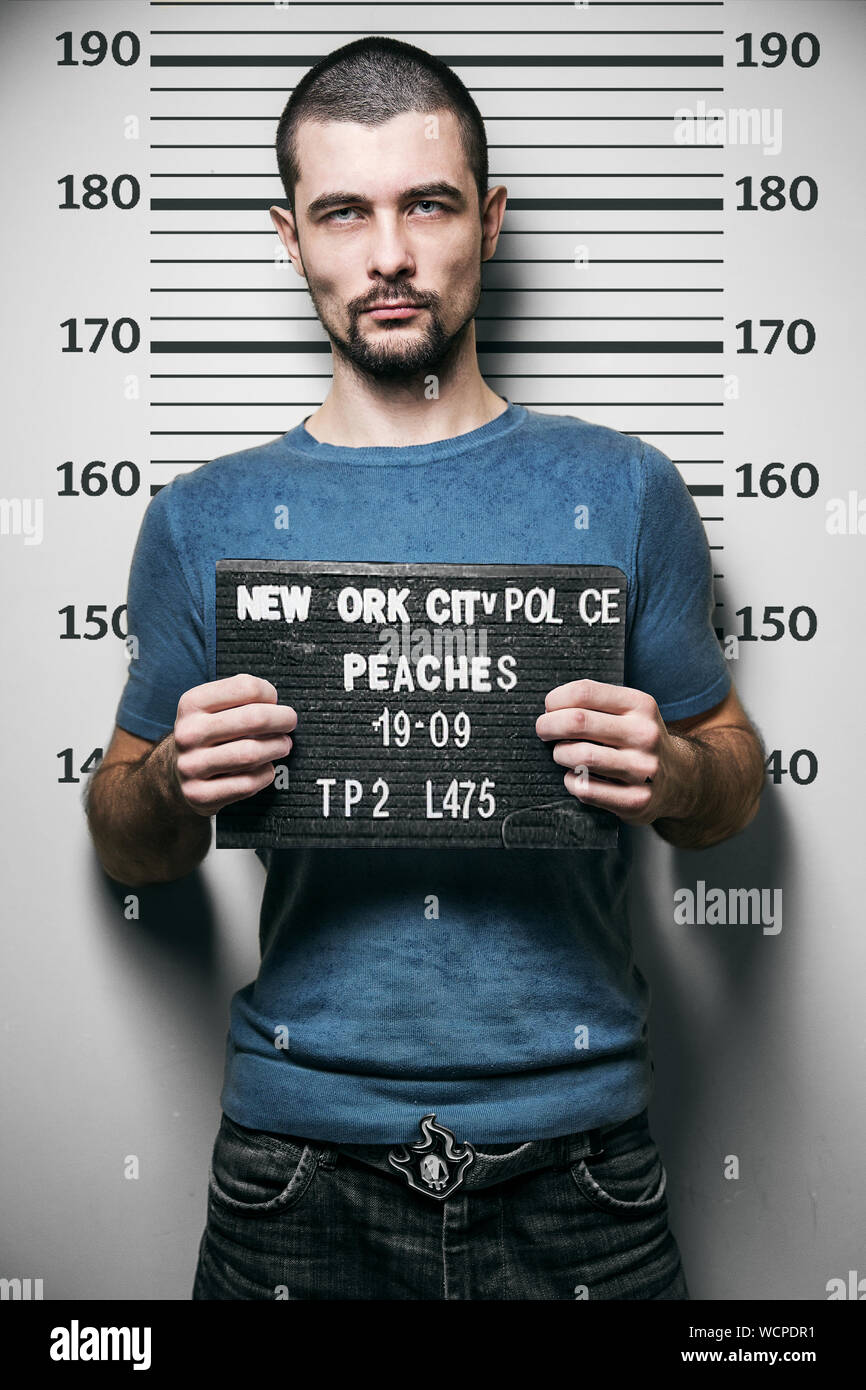 Police young man station hi-res stock photography and images - Alamy
