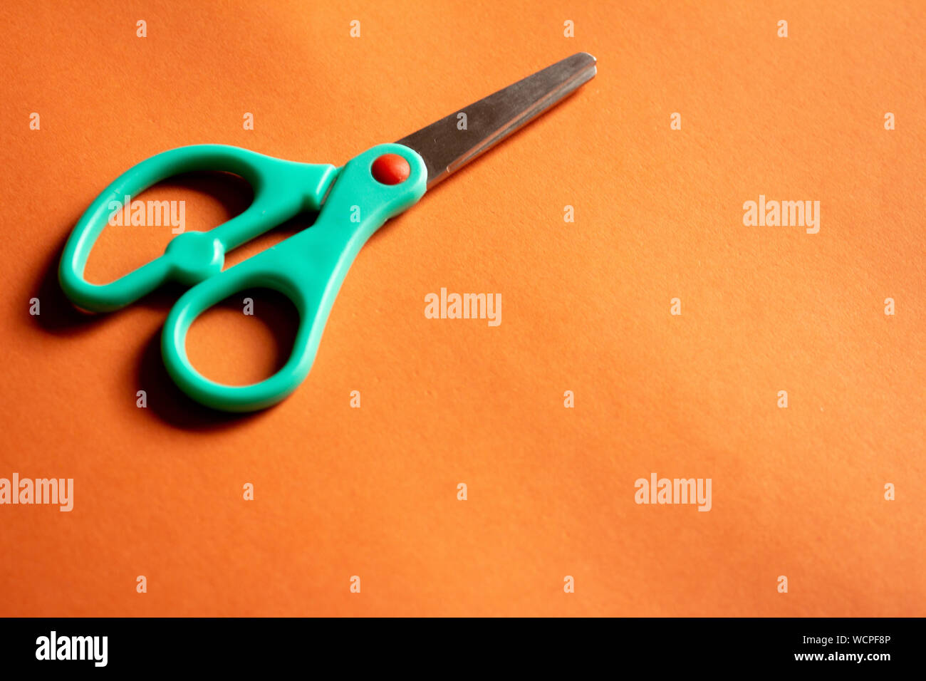 small scissor on plain background Stock Photo - Alamy