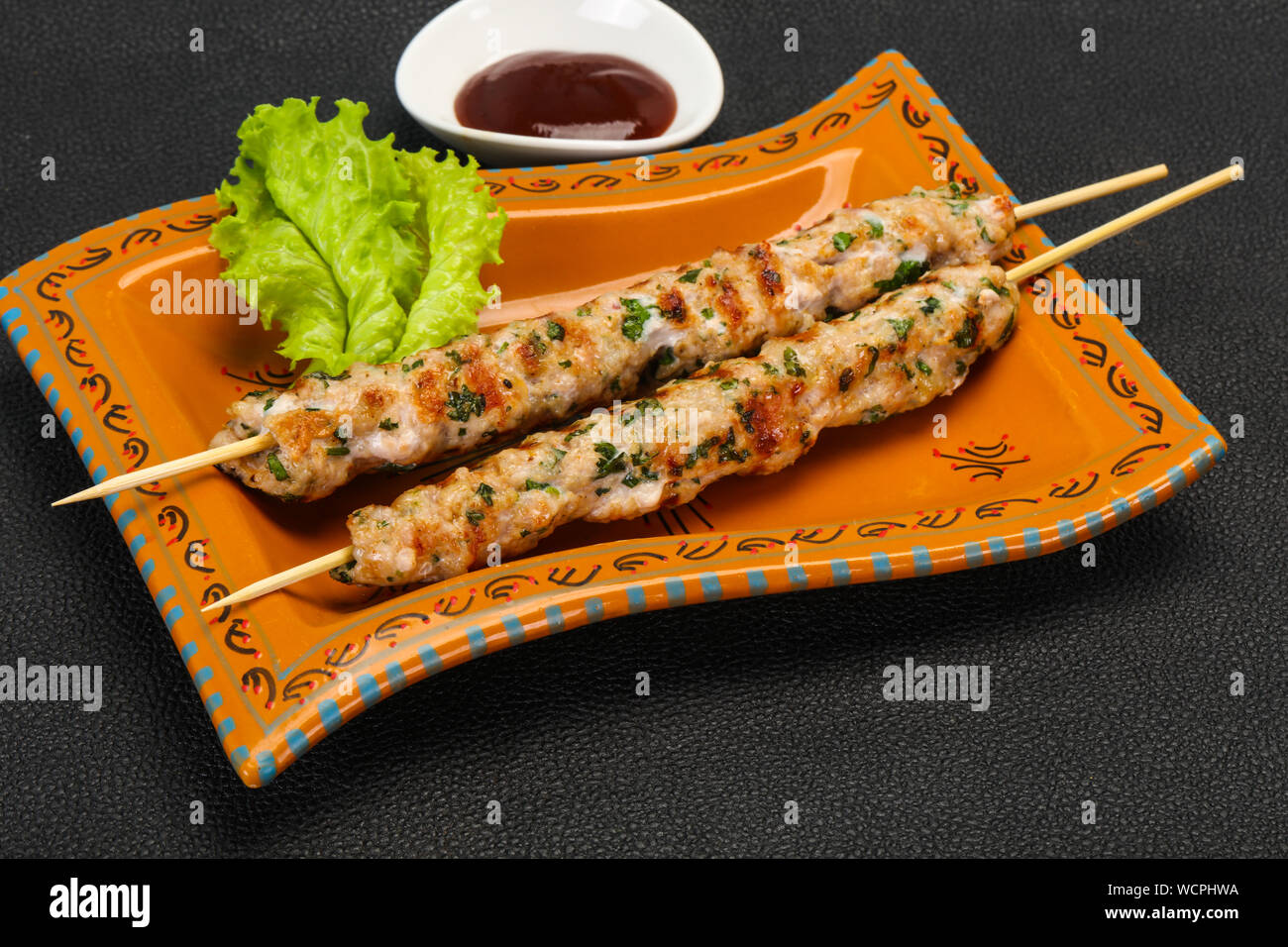 Minced pork skewer kebab with bbq sauce Stock Photo - Alamy