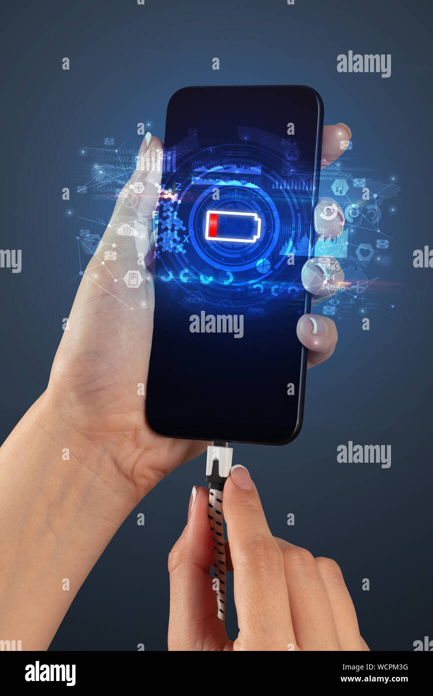 Elegant hand charging smartphone with global report concept Stock Photo ...