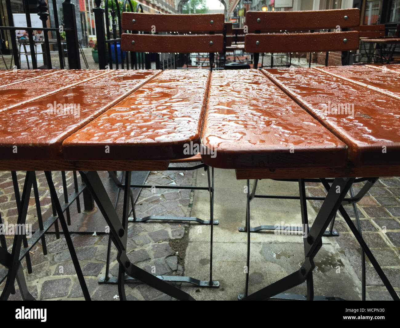Wet tables and chairs hi-res stock photography and images - Alamy