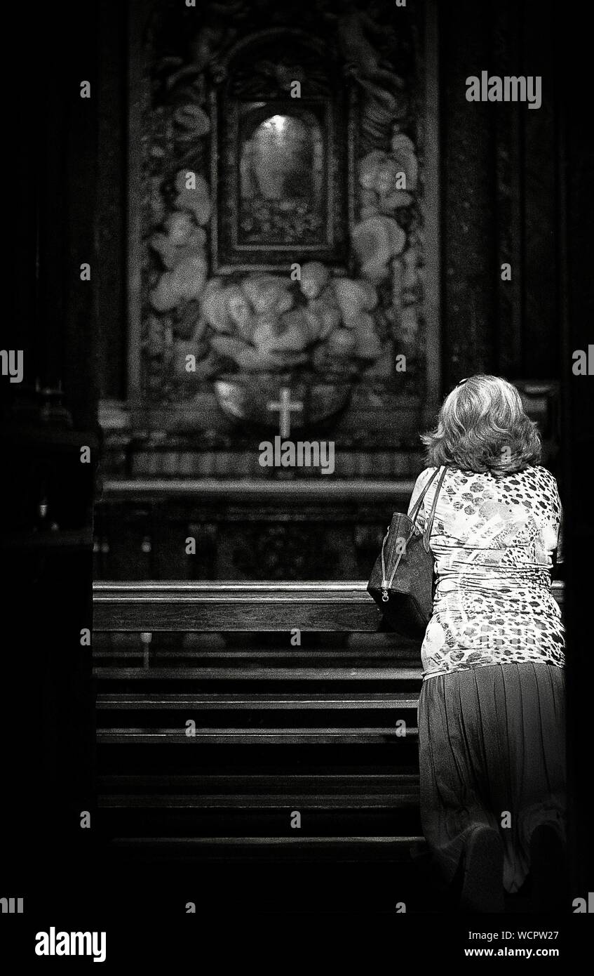 Person praying church hi-res stock photography and images - Alamy