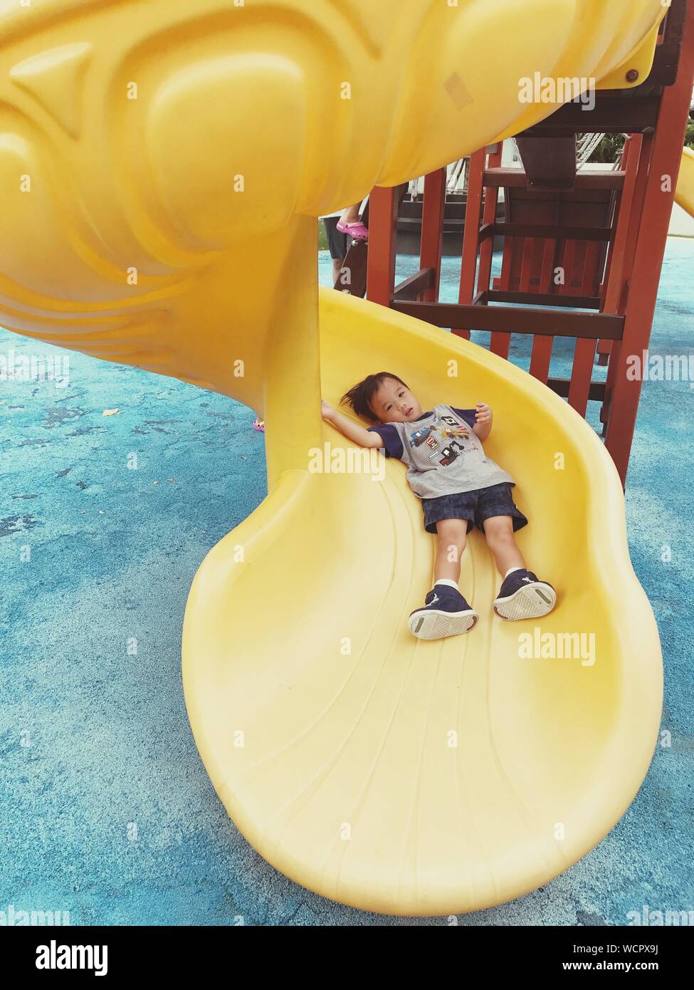 Asian boy sliding hi-res stock photography and images - Alamy