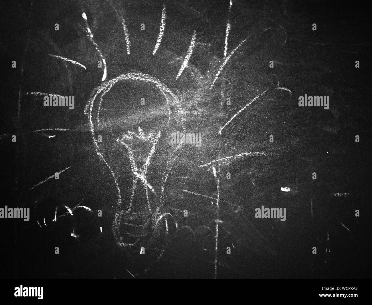 Blackboard with electric light bulb drawing with chalk Stock Photo - Alamy