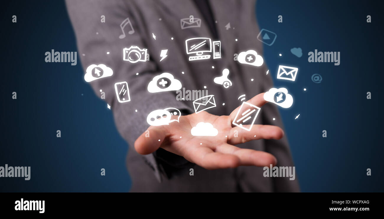 Hand holding application icons and symbols in her hand Stock Photo - Alamy