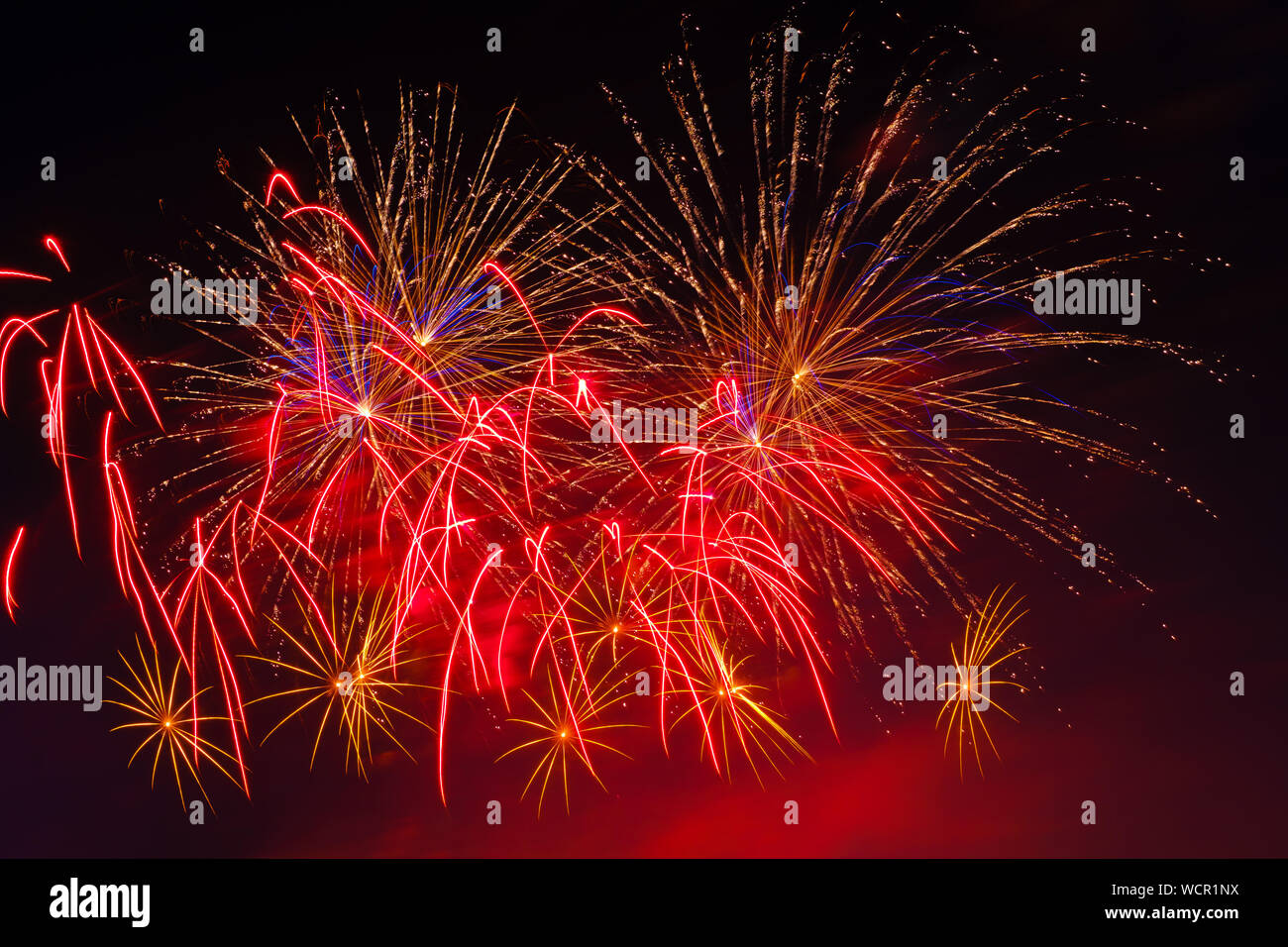 Colorful fireworks in night sky background Stock Photo - Alamy