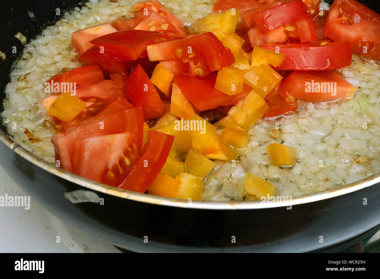 Making sauce, dressing for vegetarian food. Fresh vegetables, tomatoes ...
