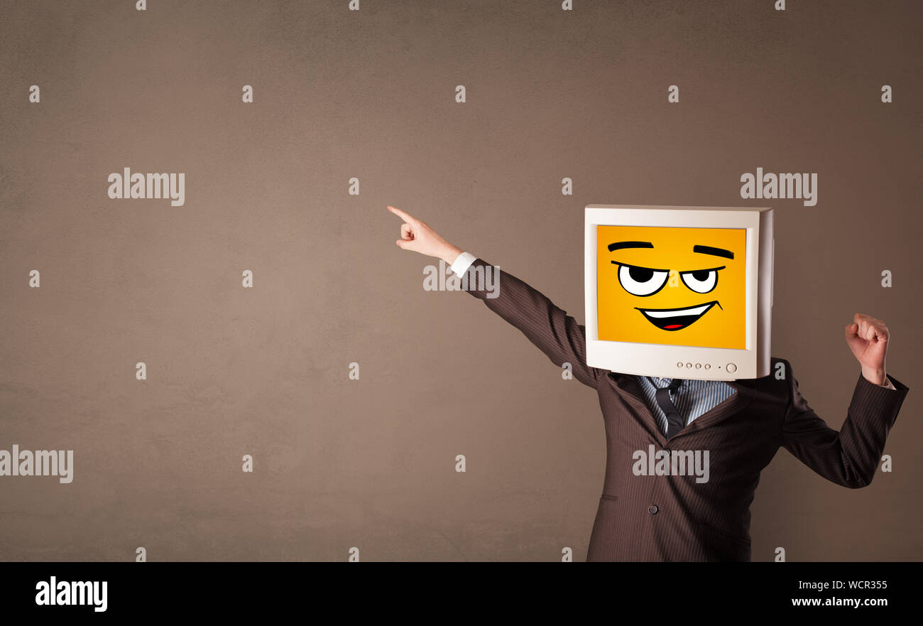 Young person with happy smiley monitor head Stock Photo - Alamy