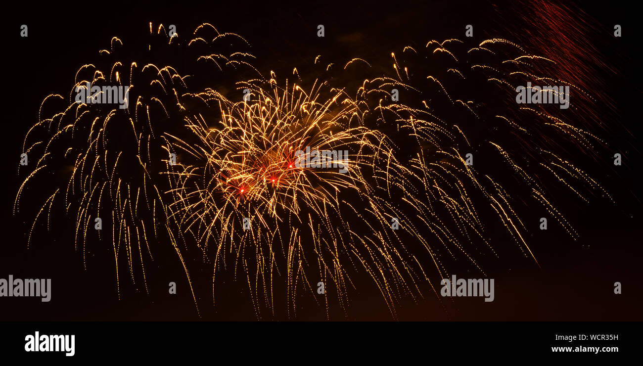 Colorful fireworks in night sky background Stock Photo - Alamy