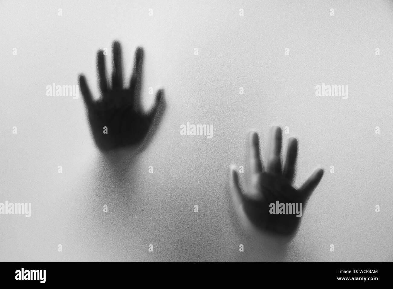 Hands against glass hi-res stock photography and images - Alamy