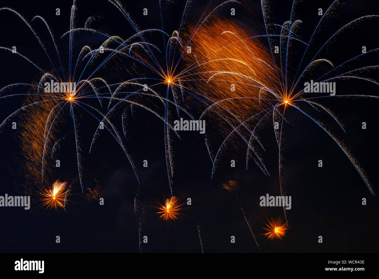 Colorful fireworks in night sky background Stock Photo - Alamy
