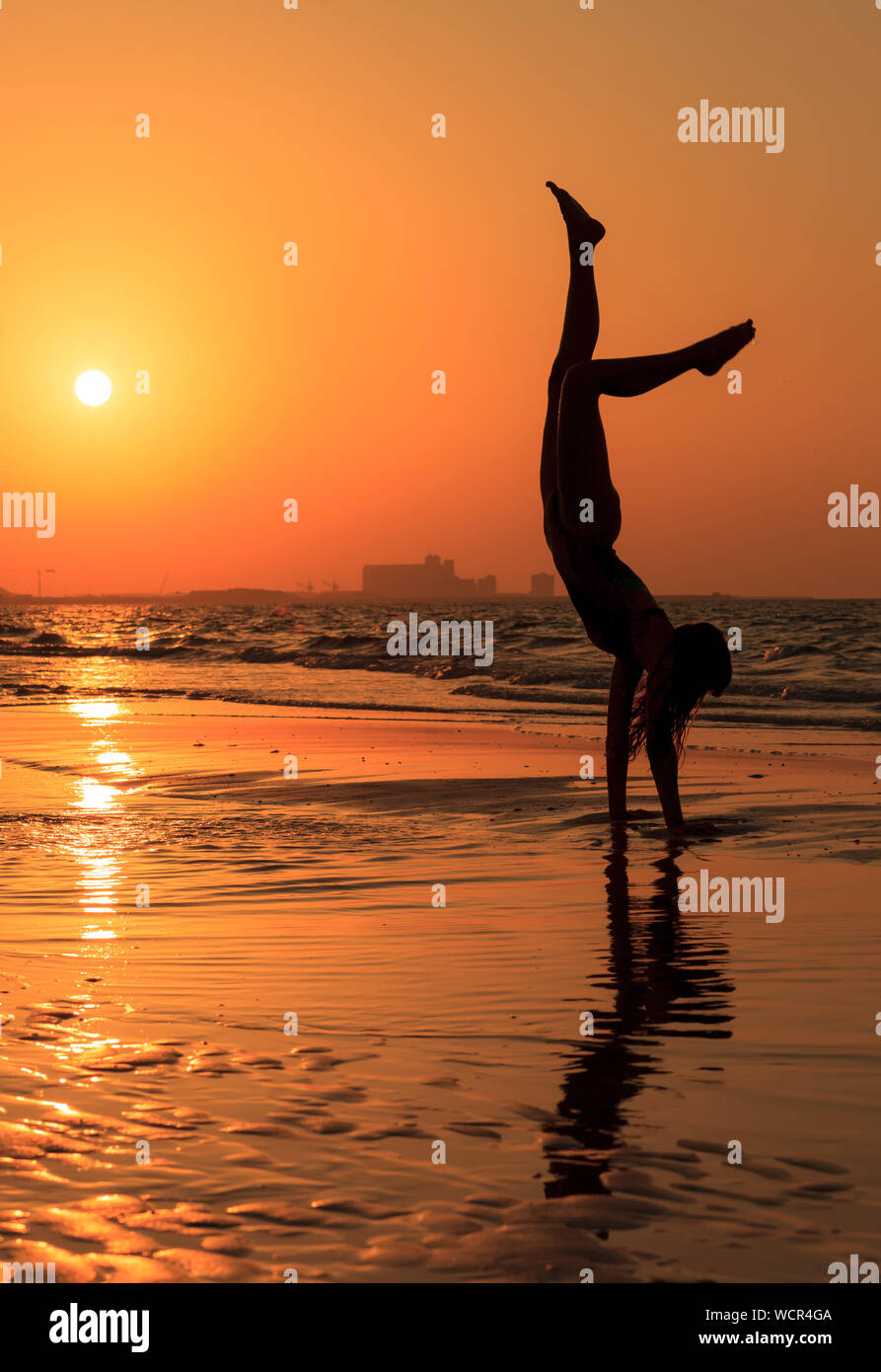 Woman beach not man bikini stretching hi-res stock photography and ...