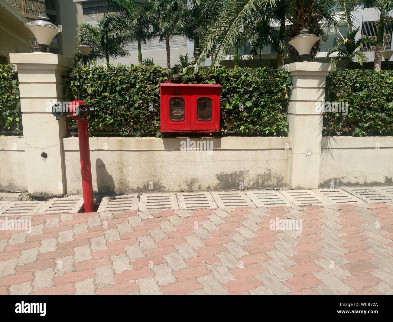 Fire Hydrant On Wall High Resolution Stock Photography and Images - Alamy