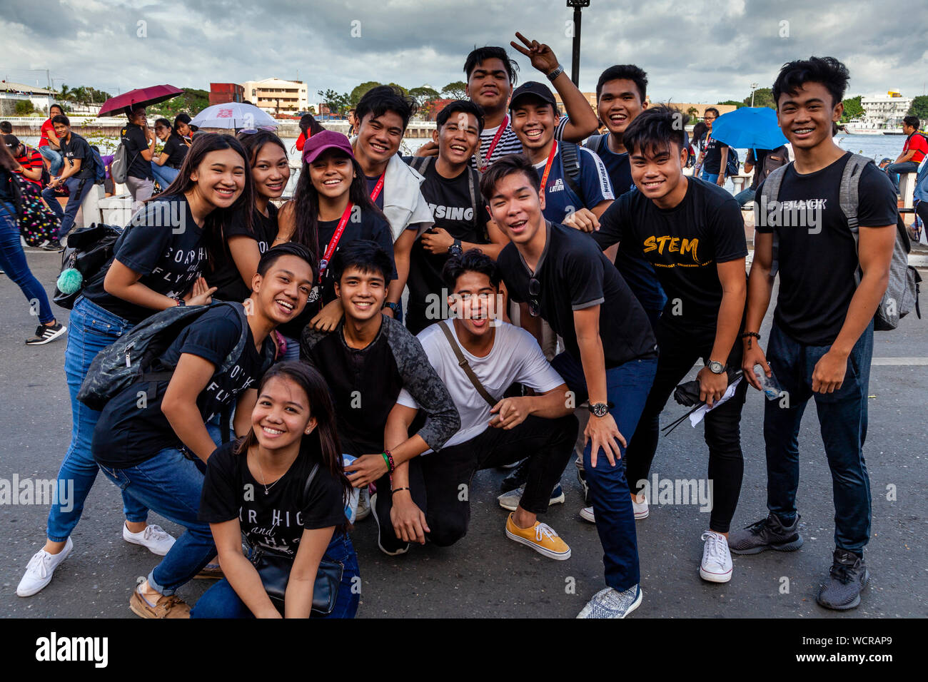 Young Filipinos Pose For A Photo During The Fluvial Procession ...