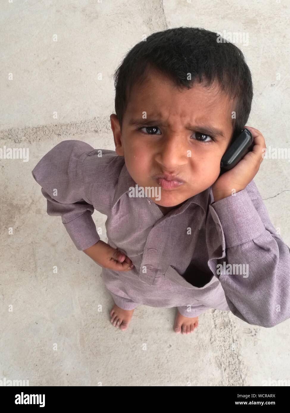 Boy making funny face hi-res stock photography and images - Alamy