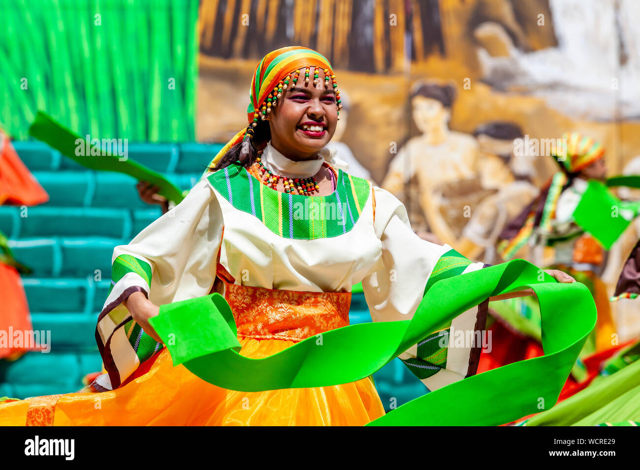 A Young Filipino Woman Dancing In The Kasadyahan Contest, Dinagyang ...