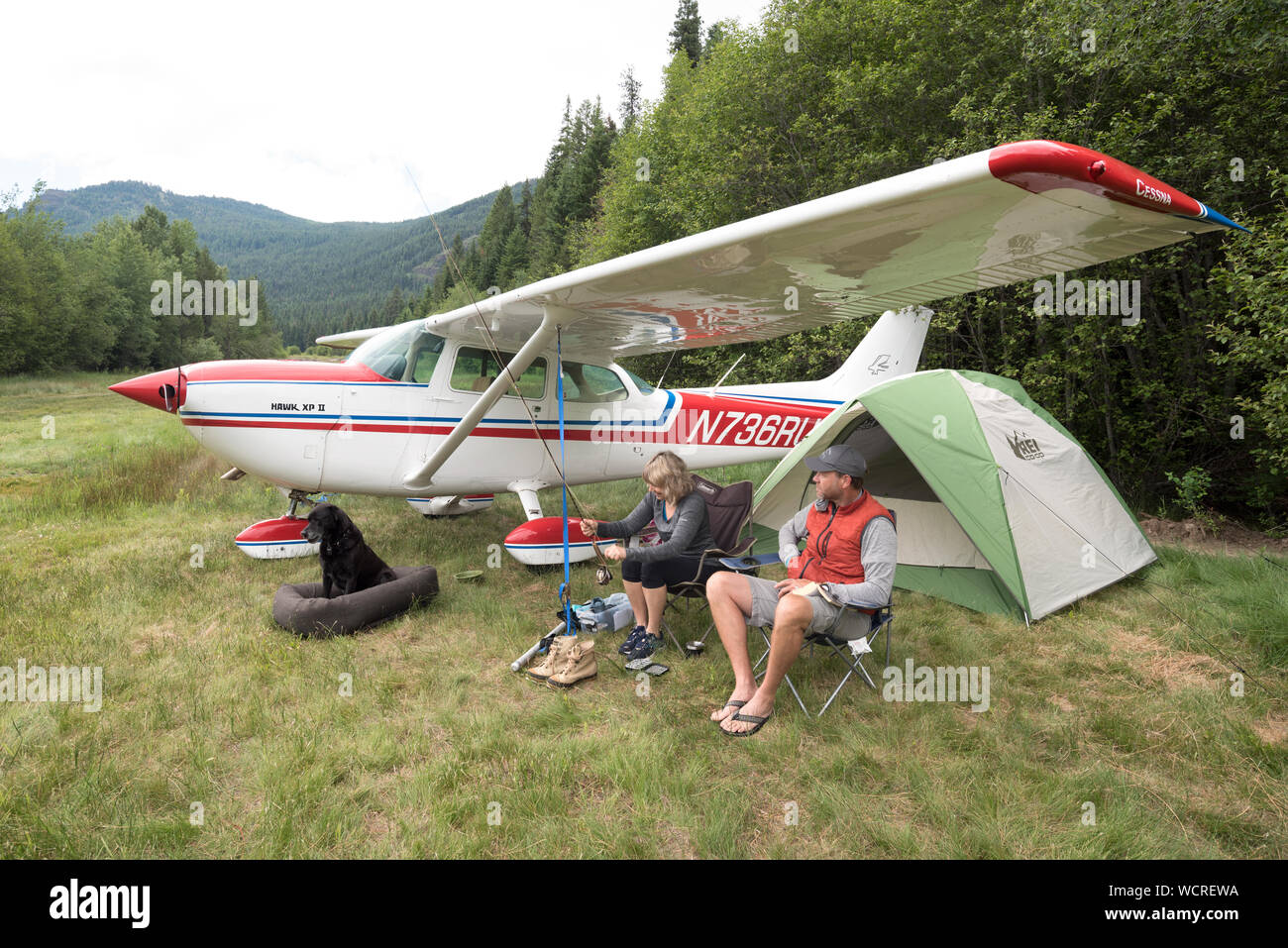 Couple camping by their airplane at the Minam River Lodge in Oregon's ...