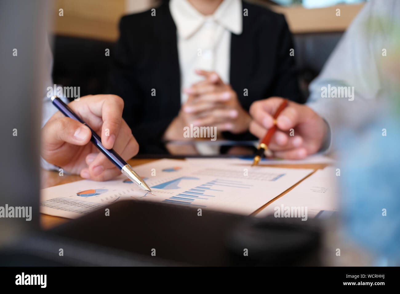 Business people holding bar graph hi-res stock photography and images ...