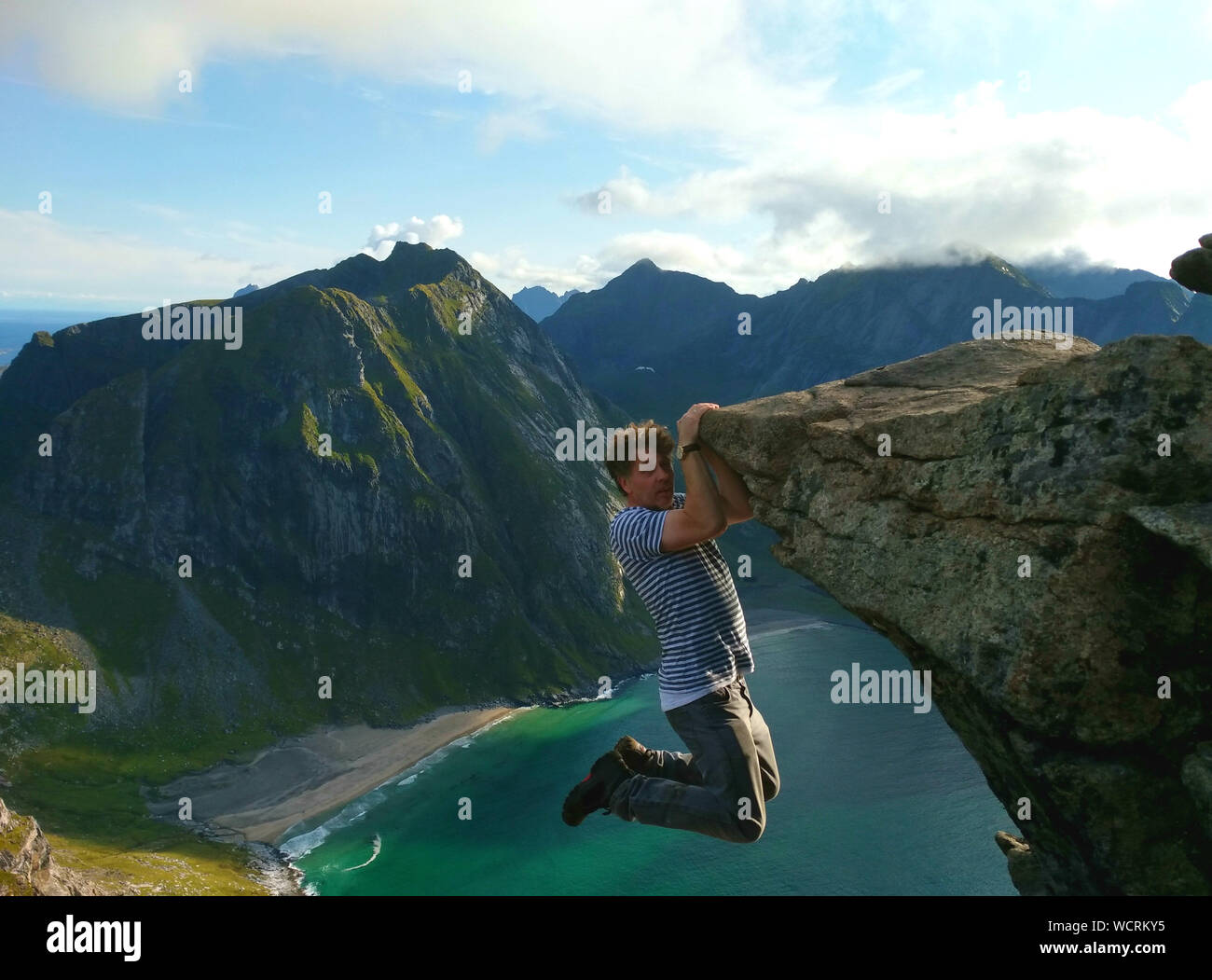Man Hanging On Cliff High Resolution Stock Photography and Images - Alamy