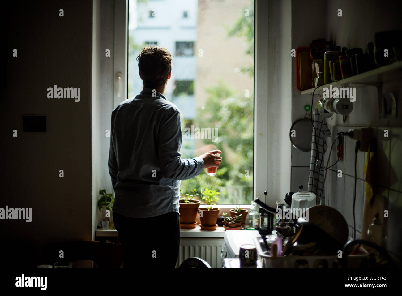 Person looking out hi-res stock photography and images - Alamy