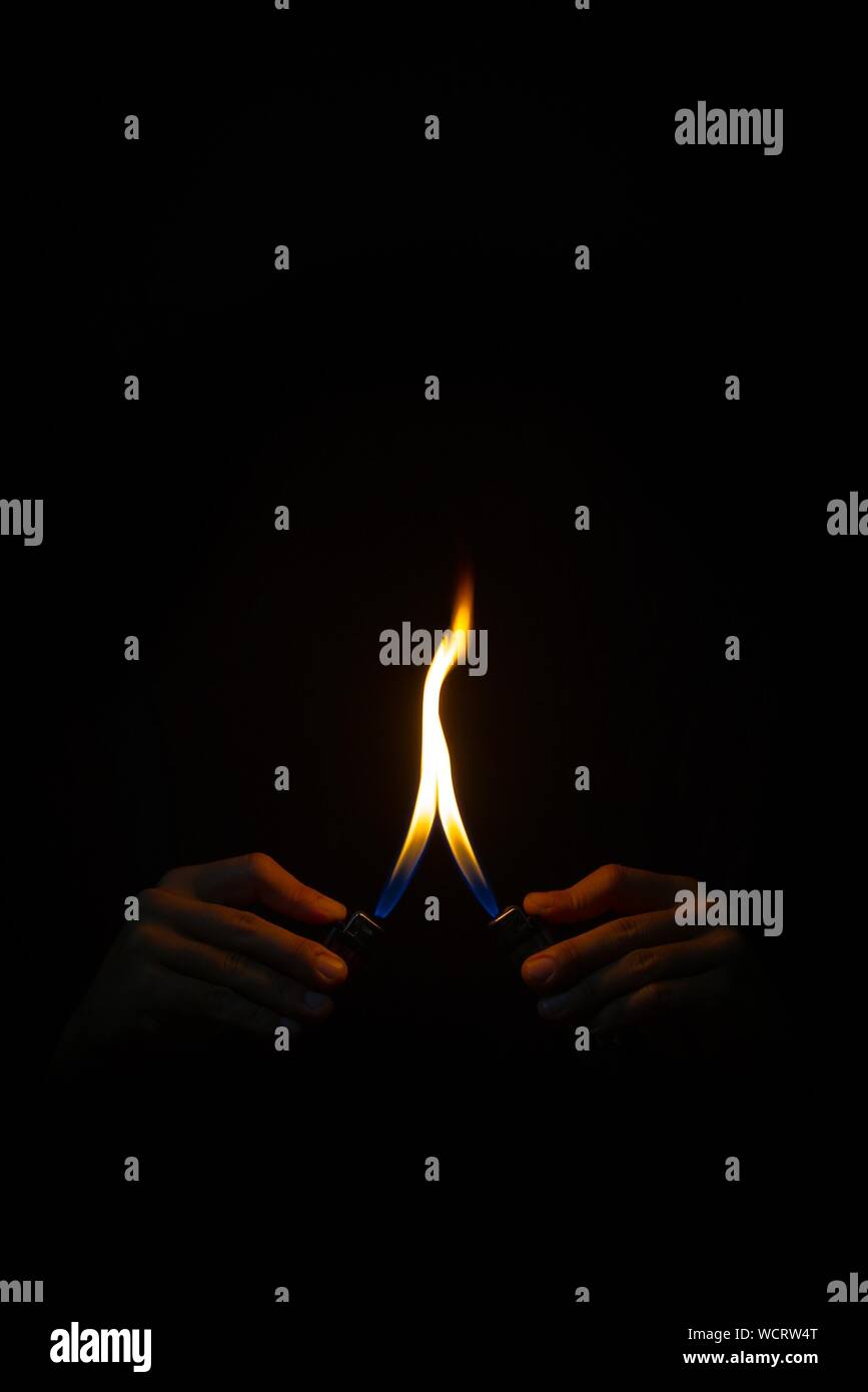 Hand holding lit lighter cigarette lighter hi-res stock photography and ...