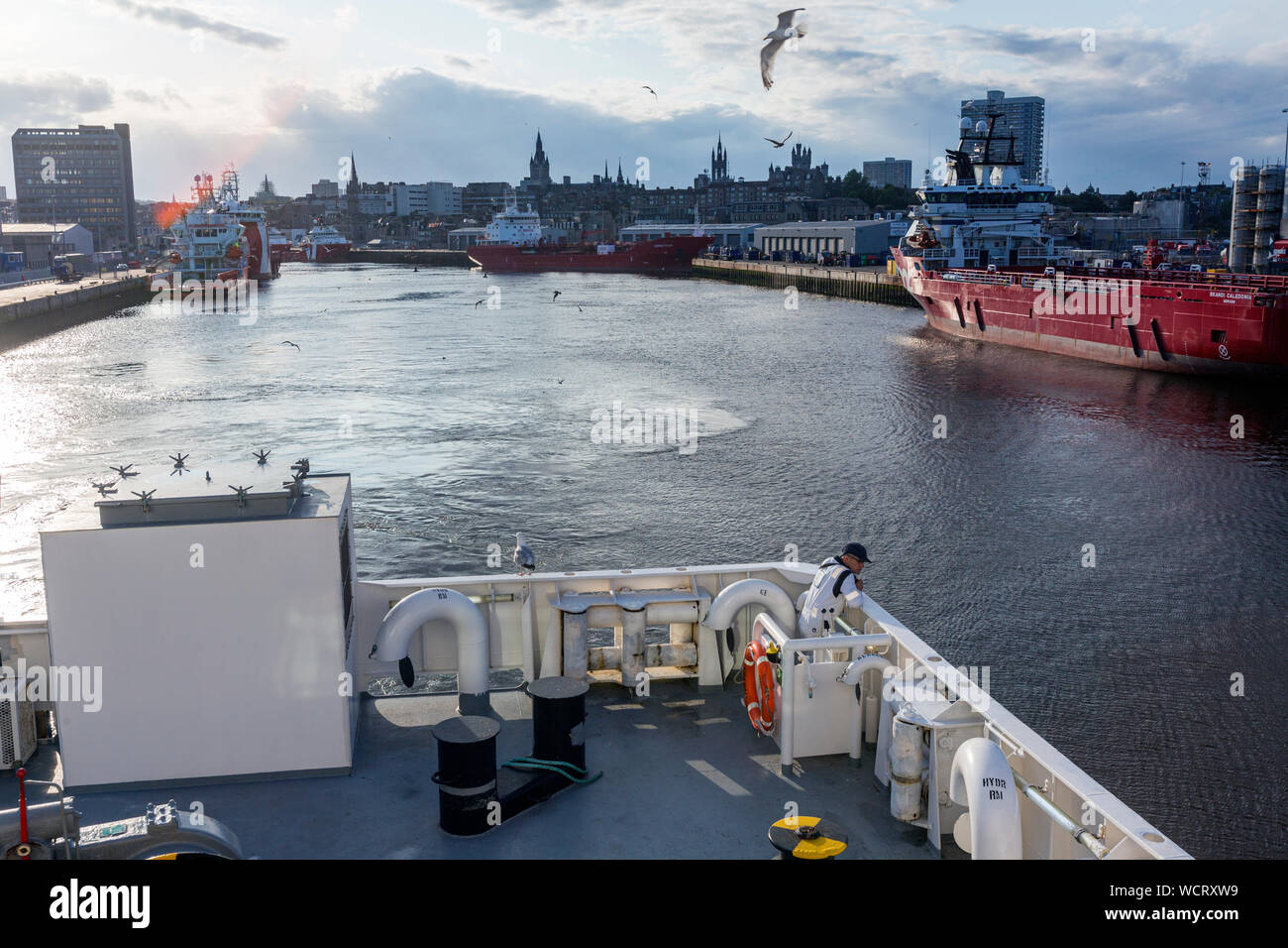 Ferry worker checking room clearance, Harbour of Aberdeen from ferry ...