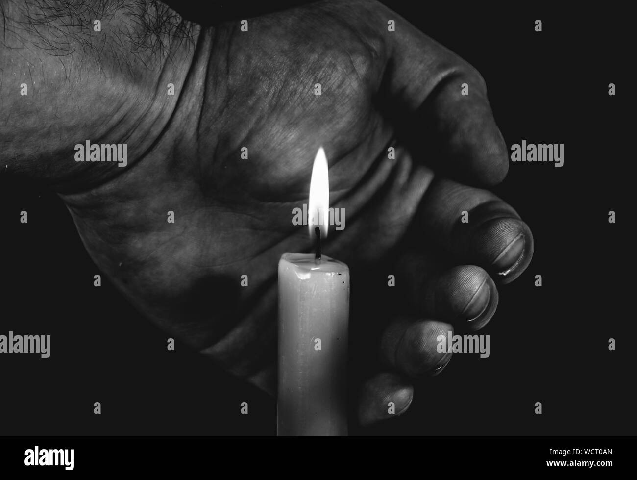 Candle hand man hi-res stock photography and images - Alamy