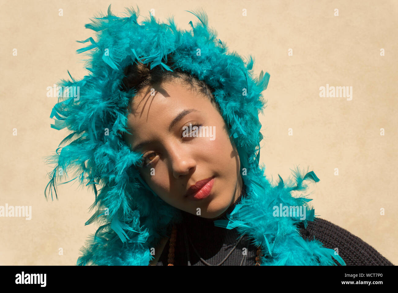 Woman wearing feather boa hi-res stock photography and images - Alamy