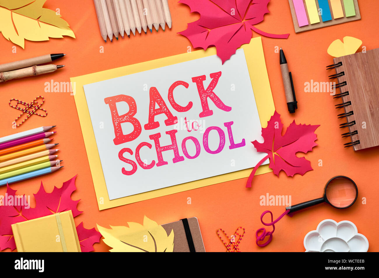 Back to school, flat lay on dark texture background with stationary and ...