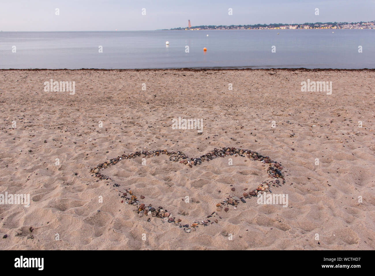 Pebble heart in water hi-res stock photography and images - Alamy